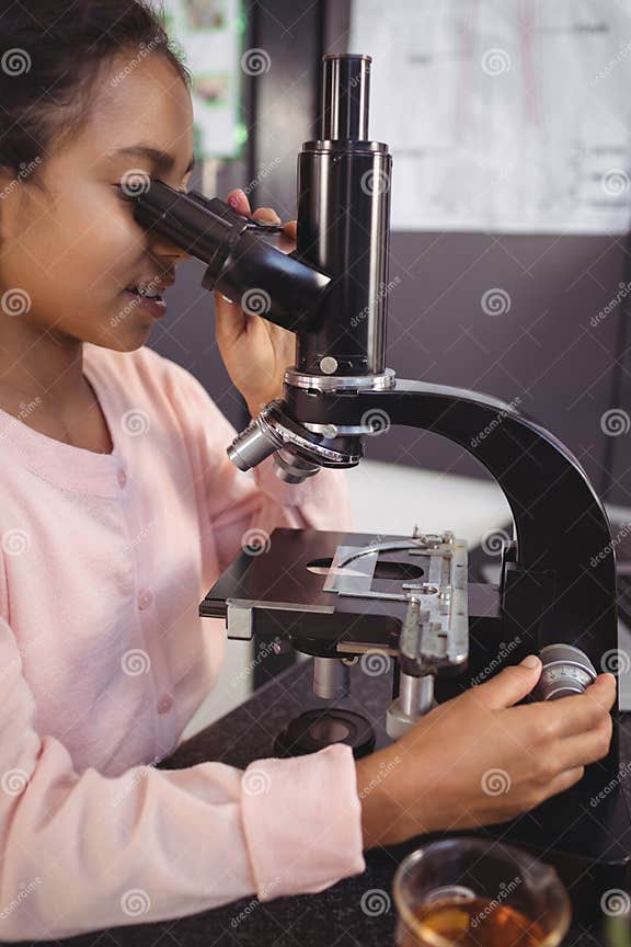 Elementary Student Using Microscope at Laboratory Stock Image - Image ...