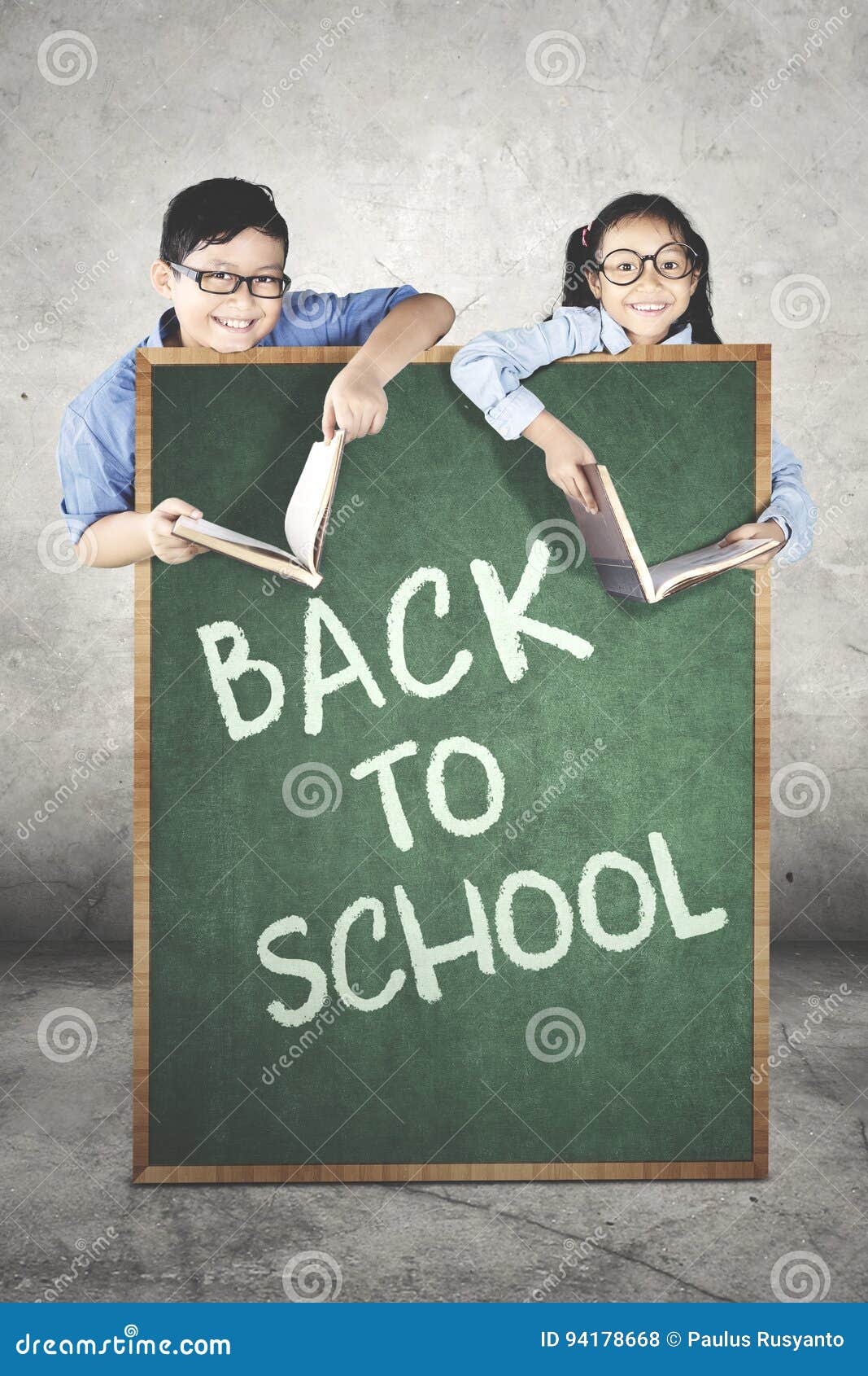 Elementary Students Behind a Chalkboard Stock Photo - Image of ...