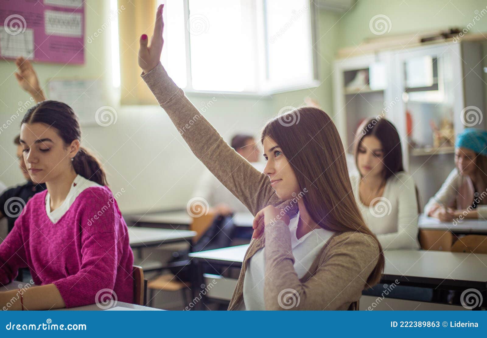 Students Raising Their Arms on a Class Stock Image - Image of girls ...