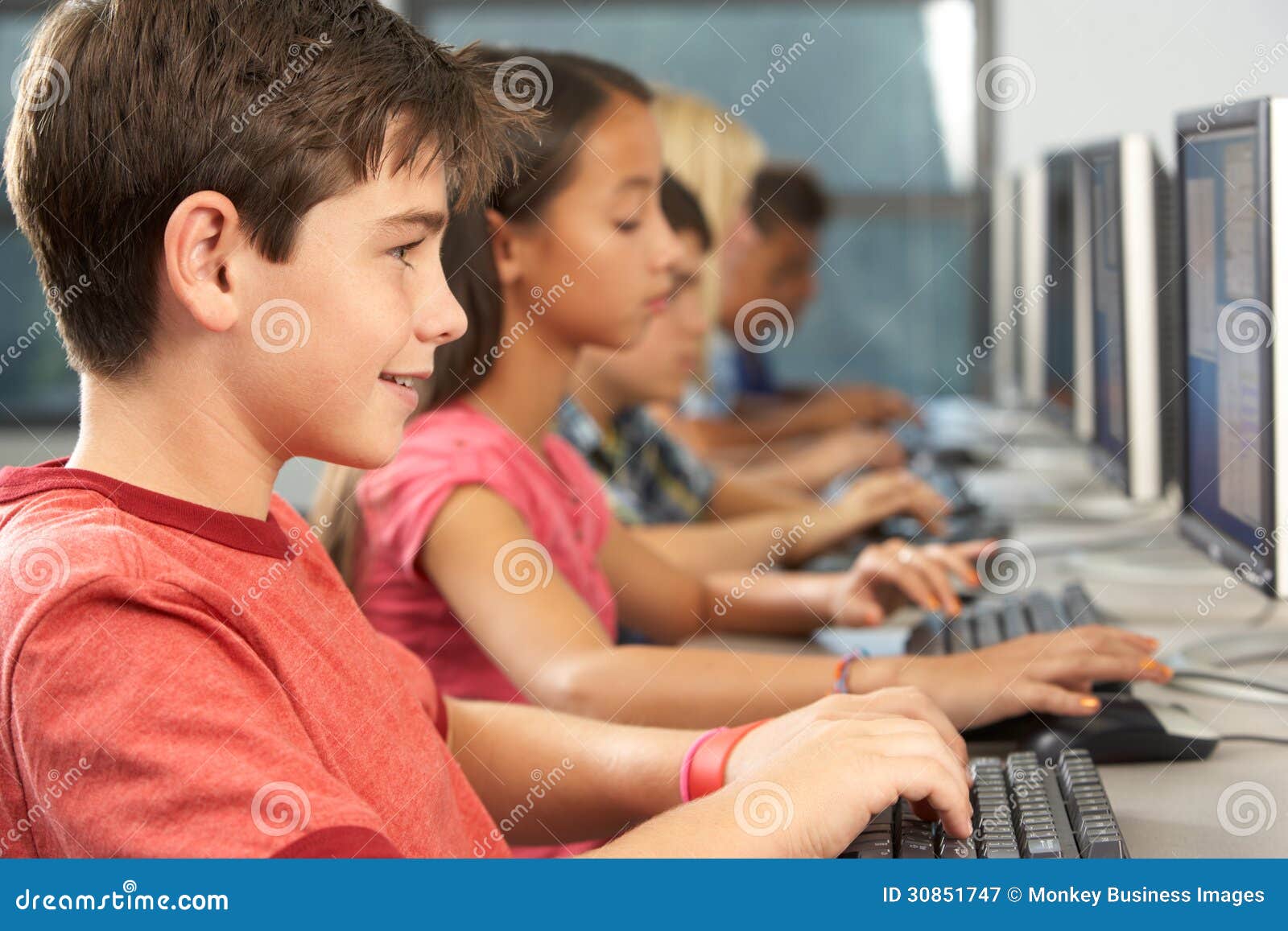 Elementary Students Working at Computers in Classroom Stock Image ...