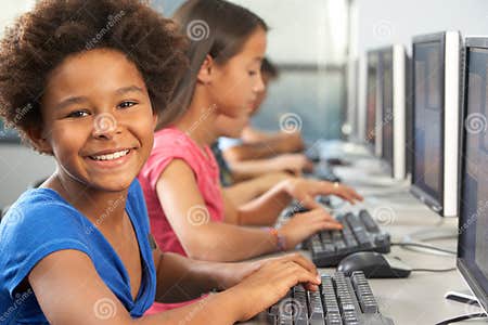 Elementary Students Working at Computers in Classroom Stock Photo ...