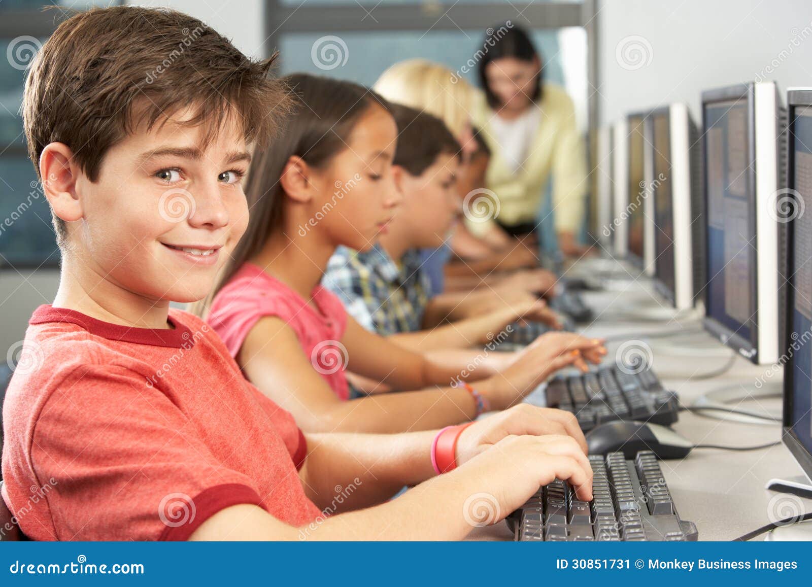 Elementary Students Working at Computers in Classroom Stock Image ... Elementary Students Working at Computers in Classroom Stock Image ...