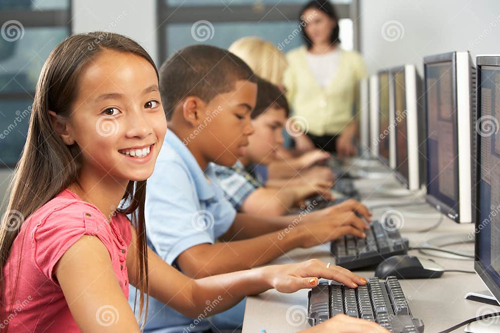 Elementary Students Working at Computers in Classroom Stock Photo ...