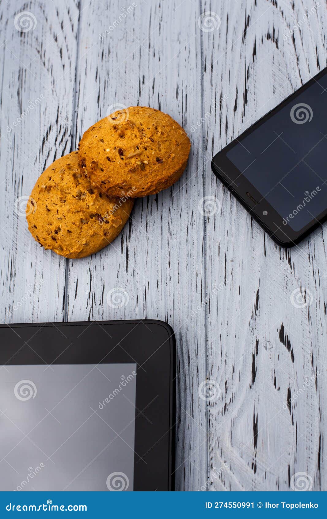 Elements of Devices, a Tablet and a Mobile Phone, and Cookies, Lie on a ...