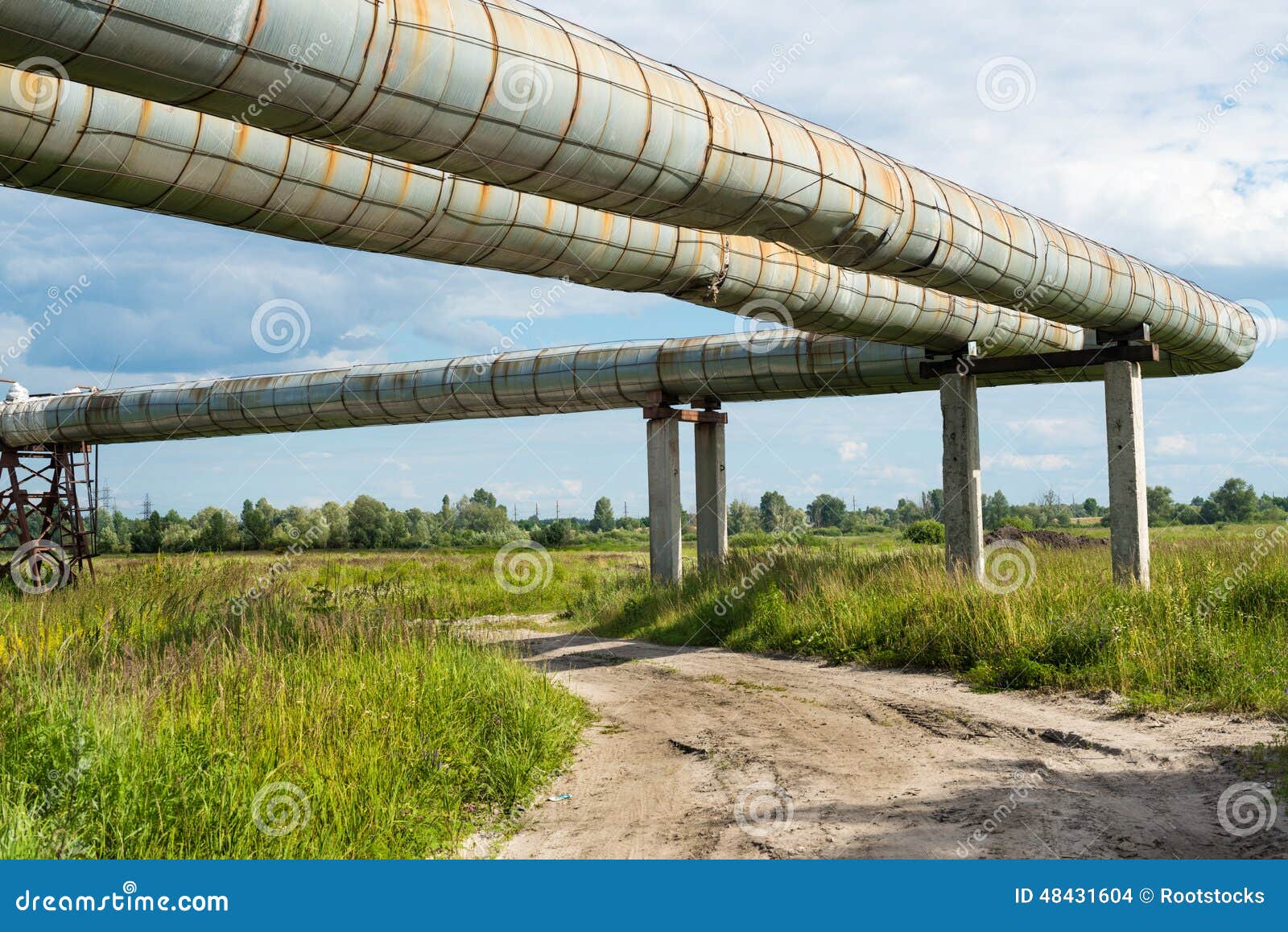 Elevated Section of the Pipelines Above the Dirt Road Stock Photo ...