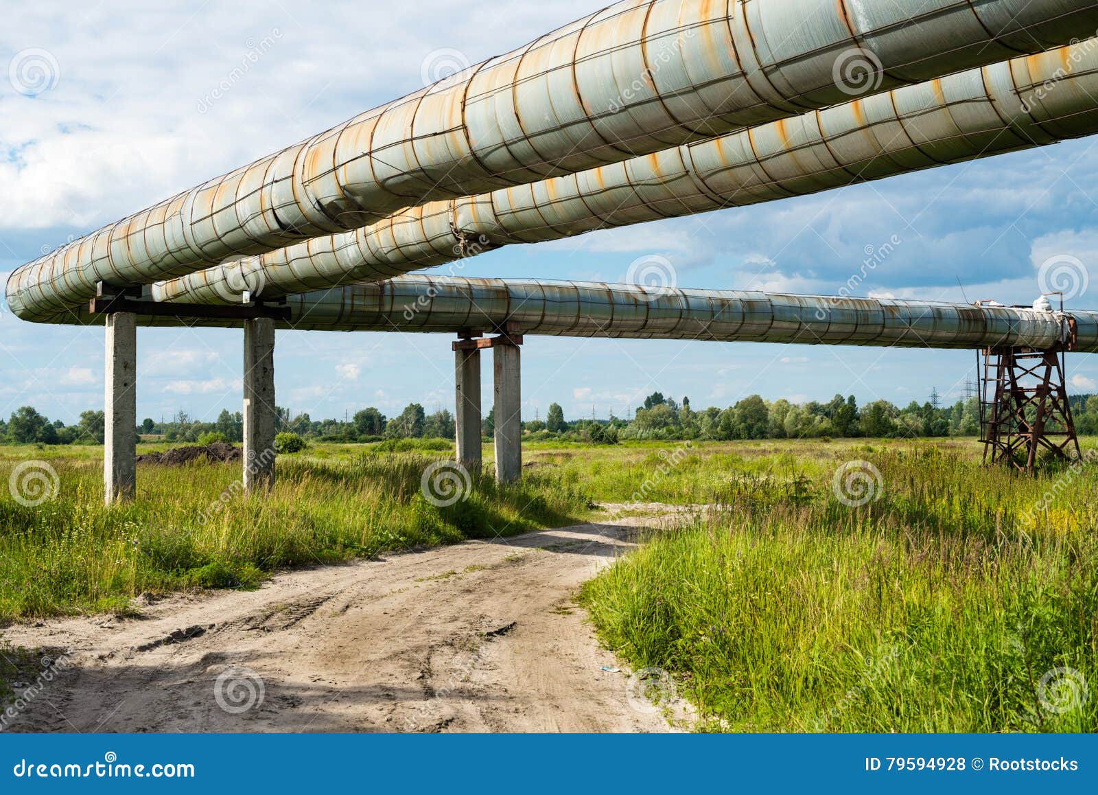Elevated Section of the Pipelines Above the Dirt Road Stock Photo ...
