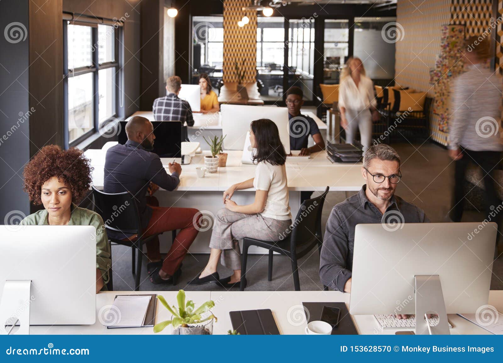 Elevated View of Creative Business Colleagues Working in a Busy Office ... Elevated View of Creative Business Colleagues Working in a Busy Office ...