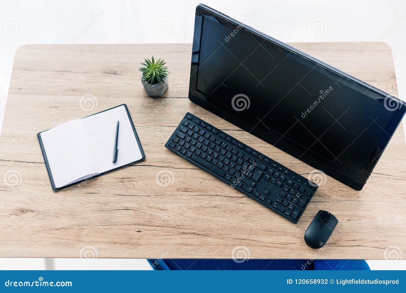 Elevated View of Empty Textbook, Potted Plant and Computer Stock Photo ...