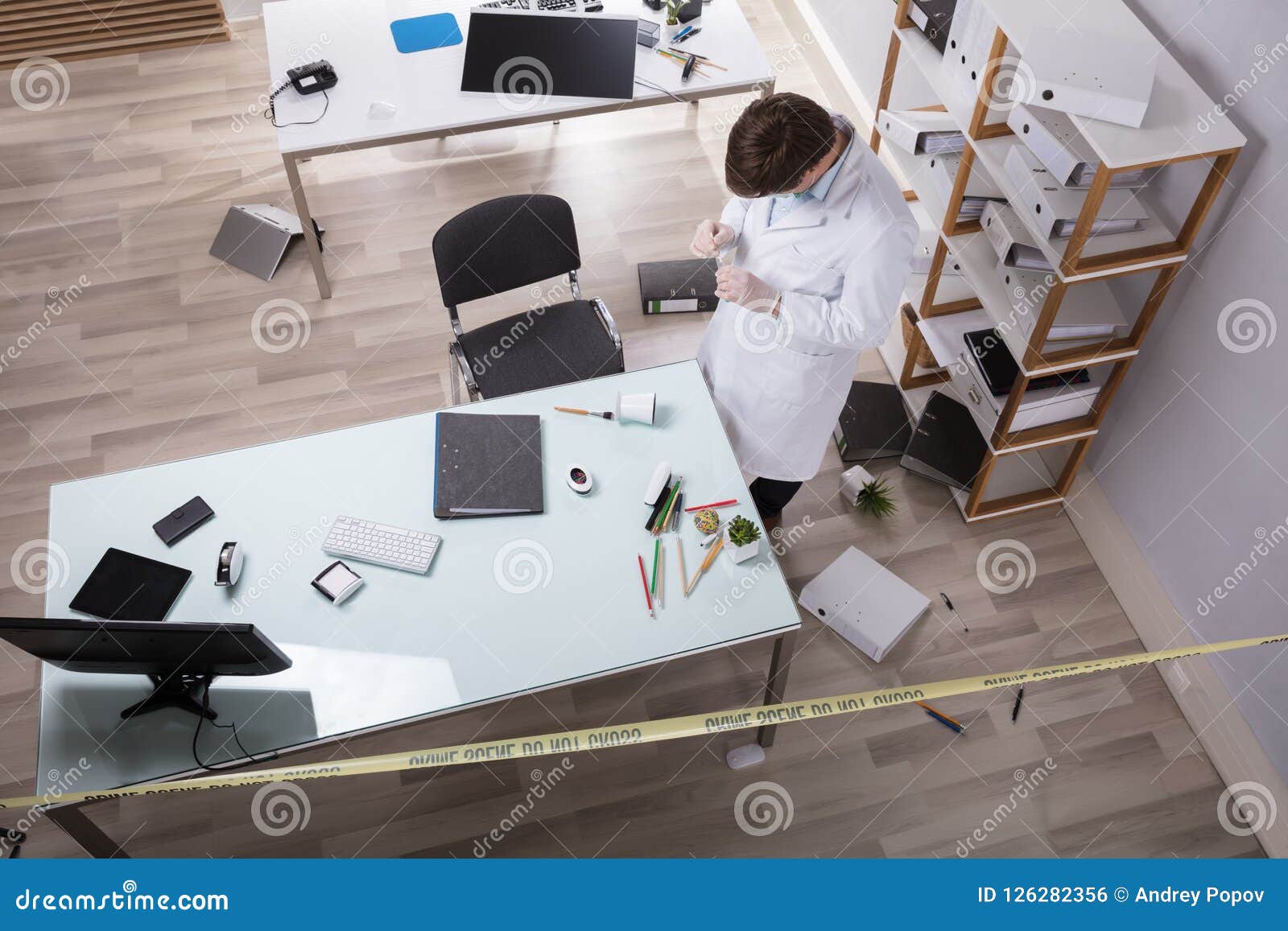 Elevated View of Forensic Expert Looking for Evidence Stock Photo ...