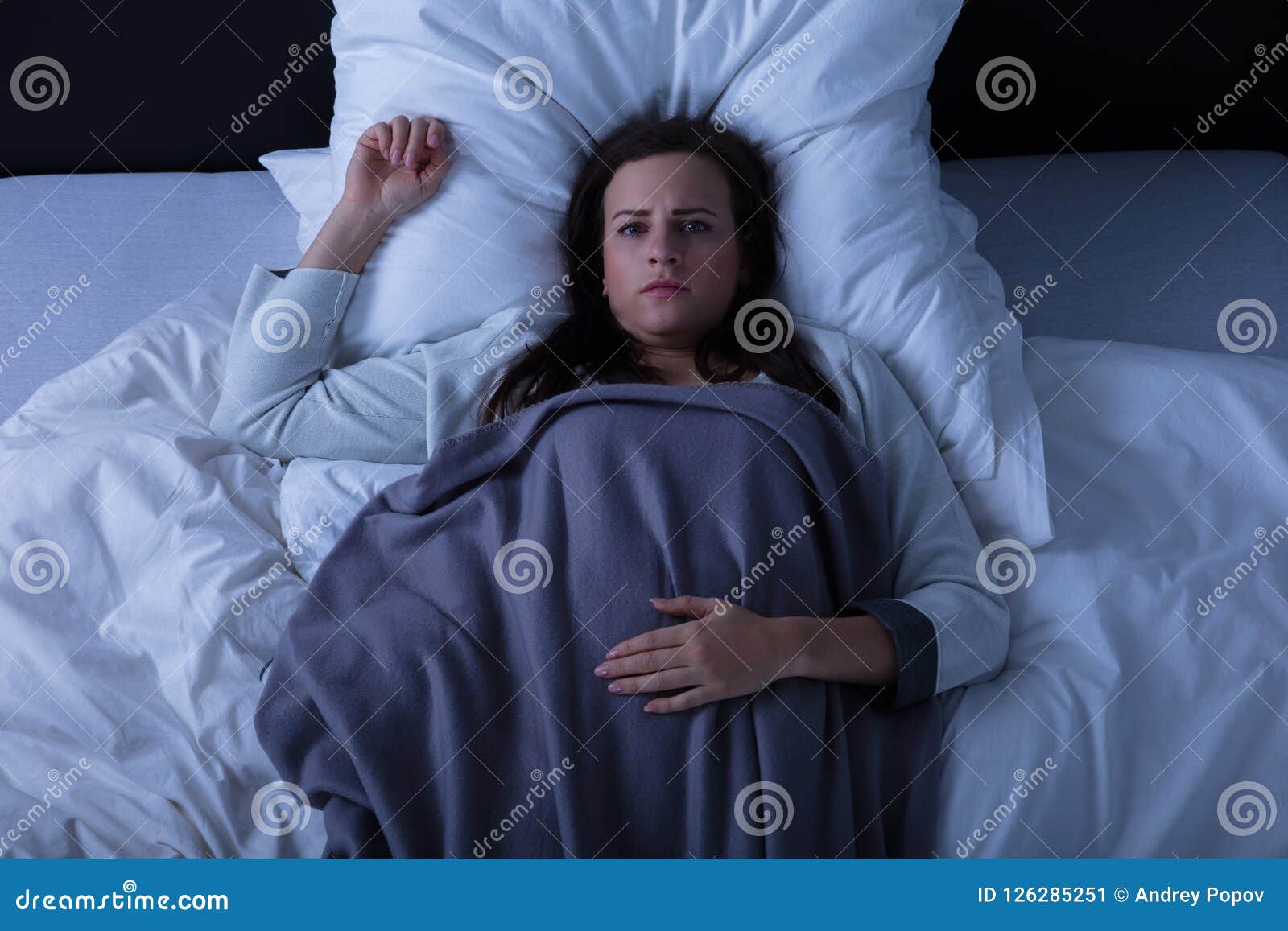 Sad Woman Lying on Bed stock image. Image of depressed - 126285251