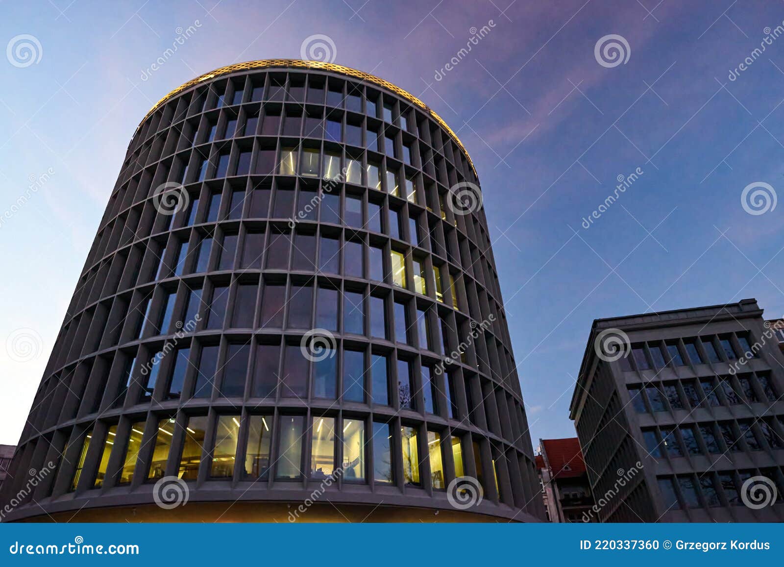 Elevation of a Modernist, Round Building at Night Stock Photo - Image ...
