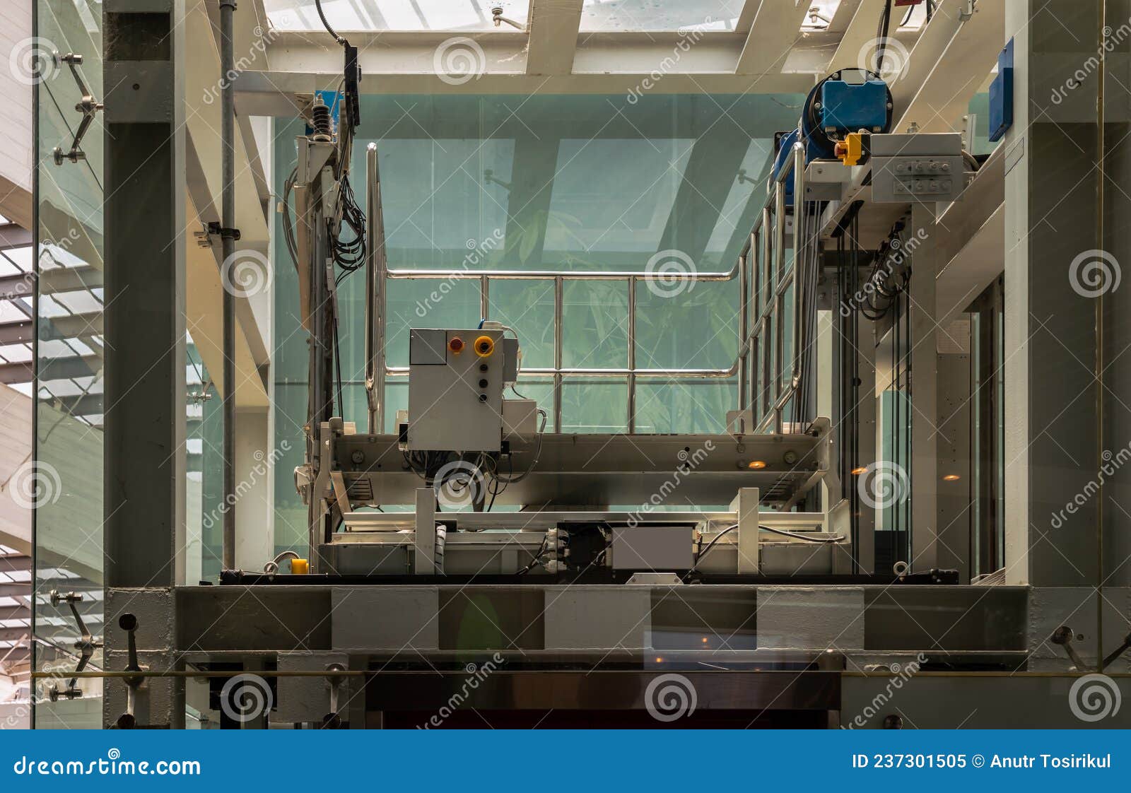 Elevator Engine Glass Room with Elevator Motor. Motor Driven Elevator ...