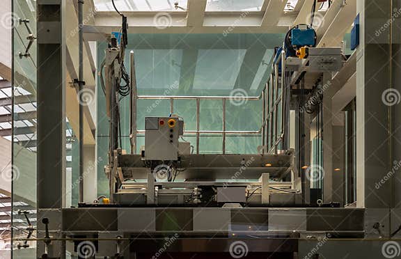 Elevator Engine Glass Room with Elevator Motor. Motor Driven Elevator ...