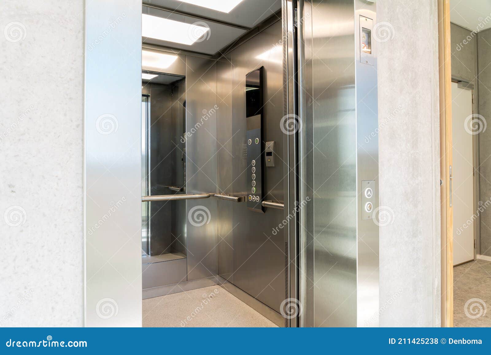 An elevator in the hall stock photo. Image of lift, panel - 211425238