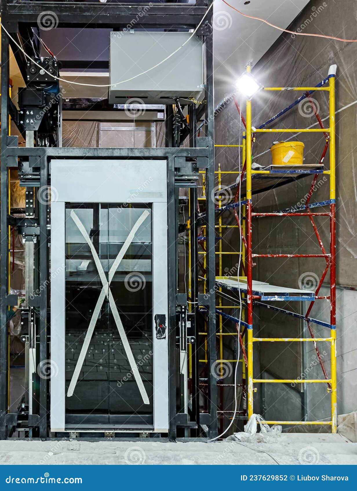 Elevator Installation, Lift Technician Installing a Modern Elevator ...