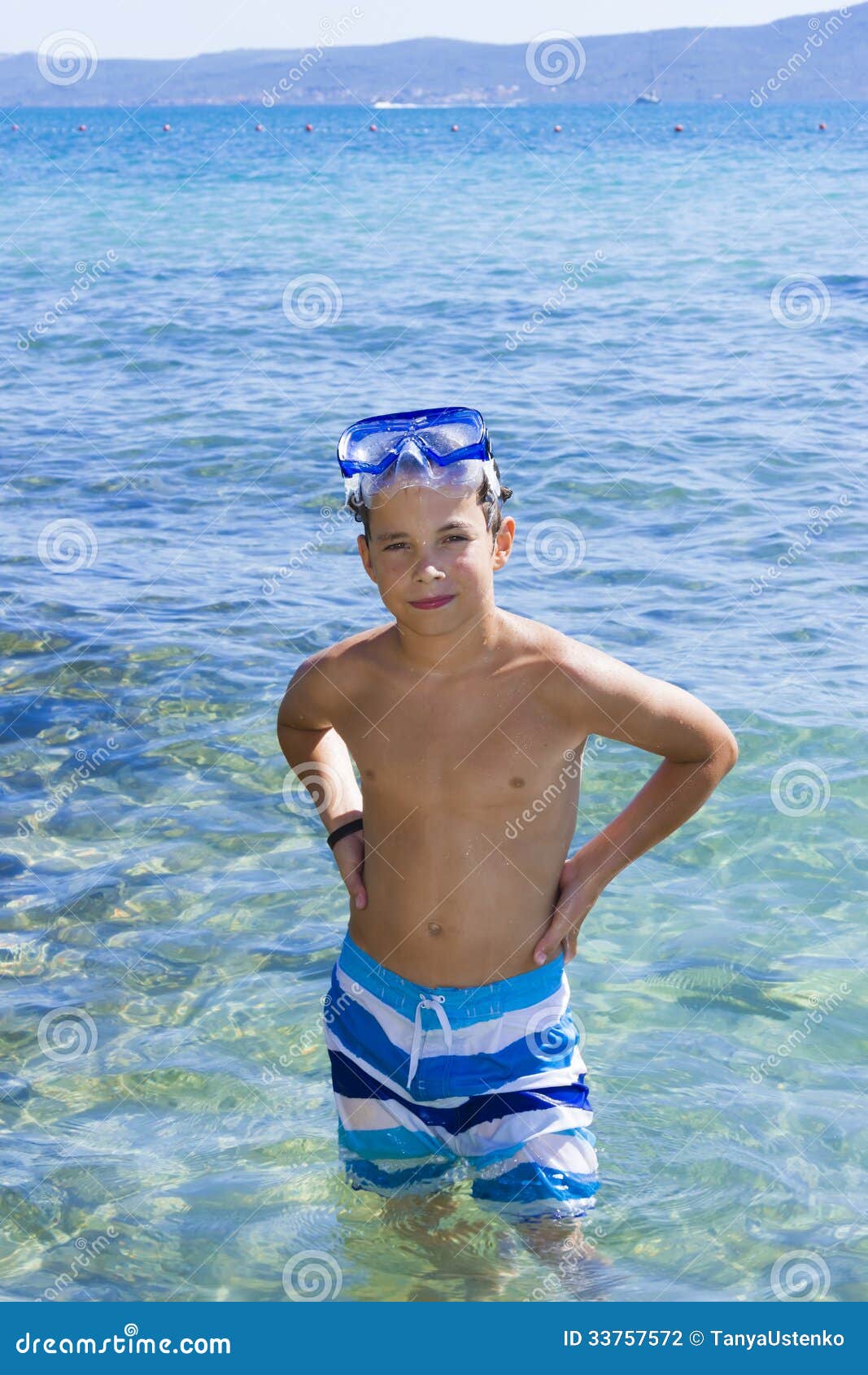 Eleven Years Old Boy in the Sea Stock Photo - Image of stones, beach ...