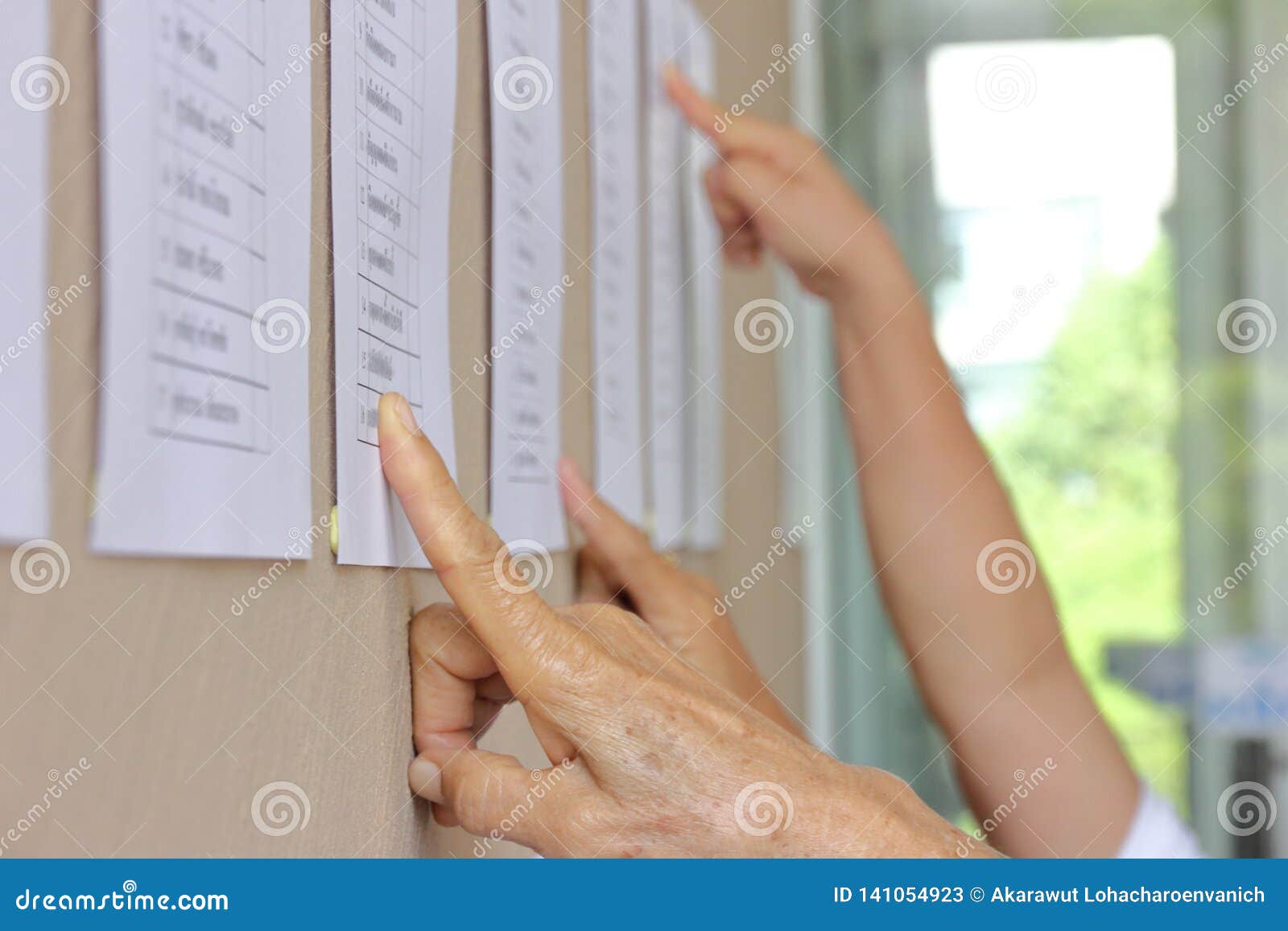 Eligible Voters Checking for Their Name at Polling Booth before the ...