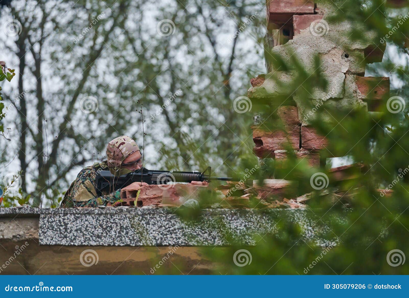 An Elite Soldier, Camouflaged and Stealthily Navigating through ... An Elite Soldier, Camouflaged and Stealthily Navigating through ...