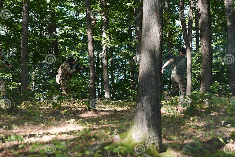 An Elite Soldier, Camouflaged and Stealthily Navigating through ... An Elite Soldier, Camouflaged and Stealthily Navigating through ...