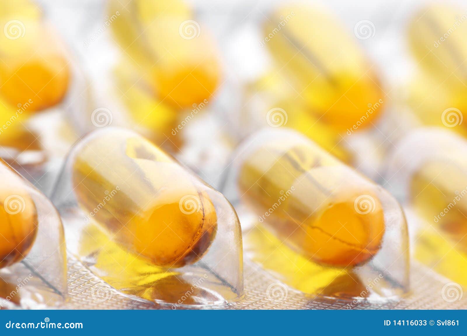 Ellipse capsules stock image. Image of gold, backlit - 14116033