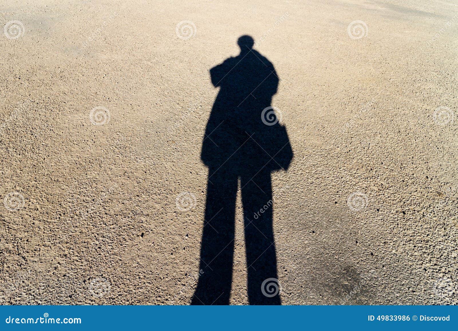 Elongated Shadow of a Person Standing on the Road Stock Photo - Image ...