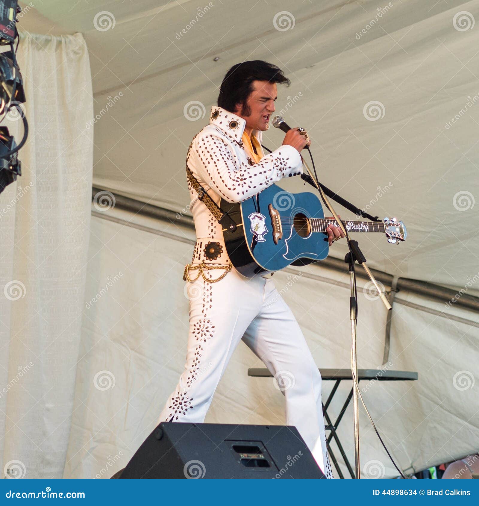 An Elvis Impersonator Singing Into A Microphone Editorial Image ...