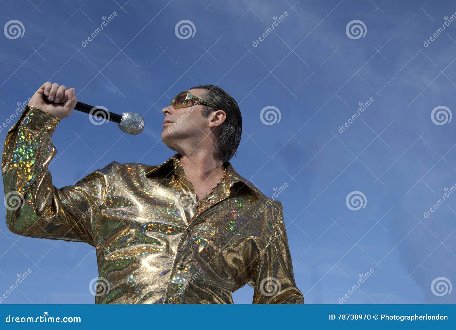 An Elvis Impersonator Singing into a Microphone Editorial Image - Image ...