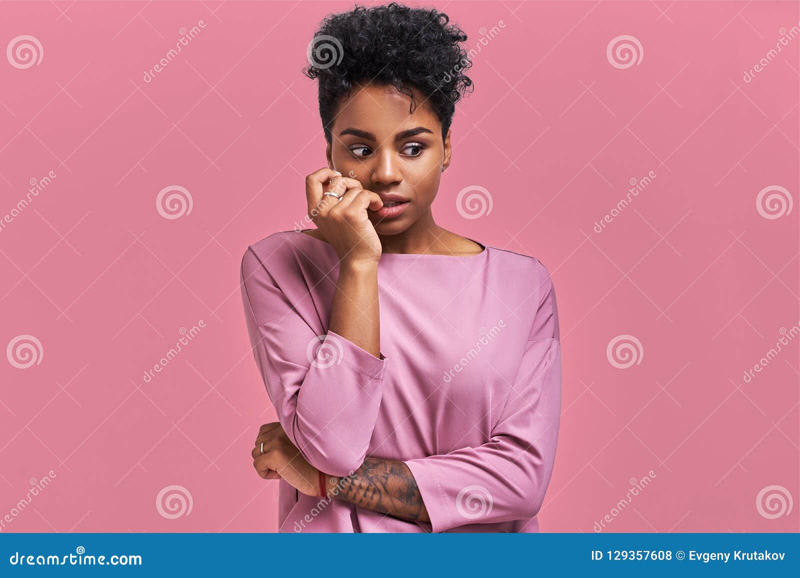 Embarrassed African American Woman Pursed Lips Looks With Puzzlement