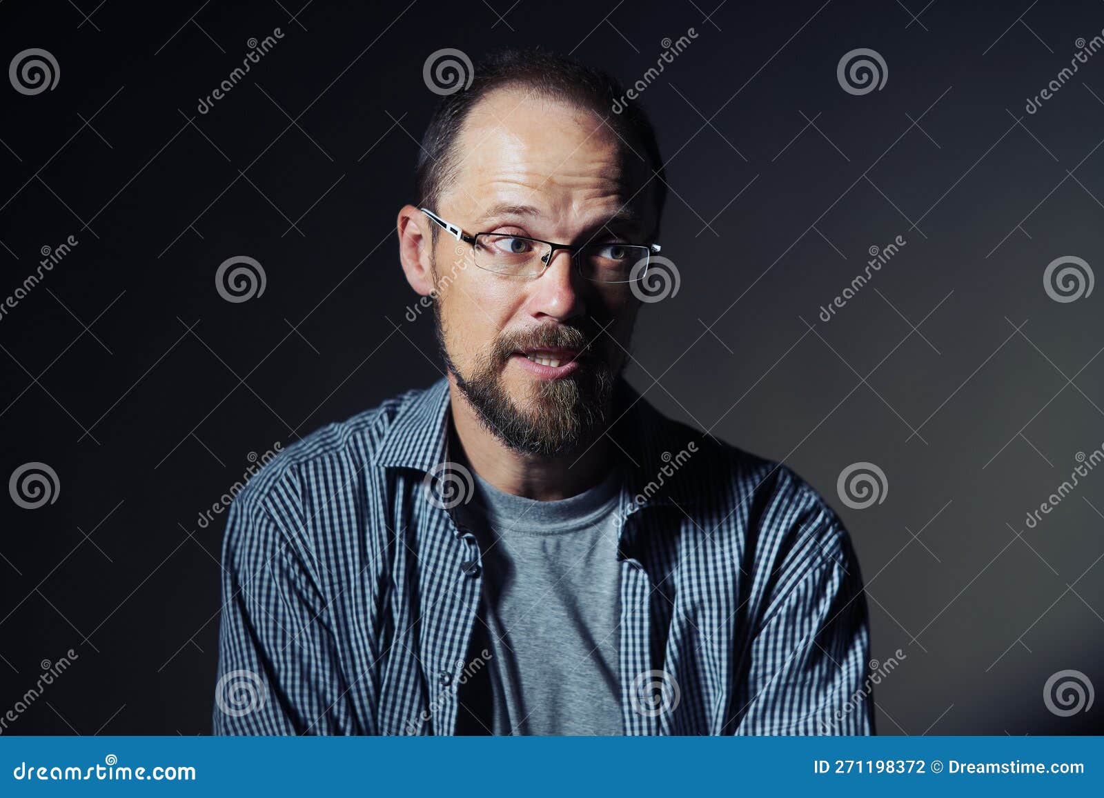 Embarrassed Middle Aged Man with Glasses Looking Out of Frame ...