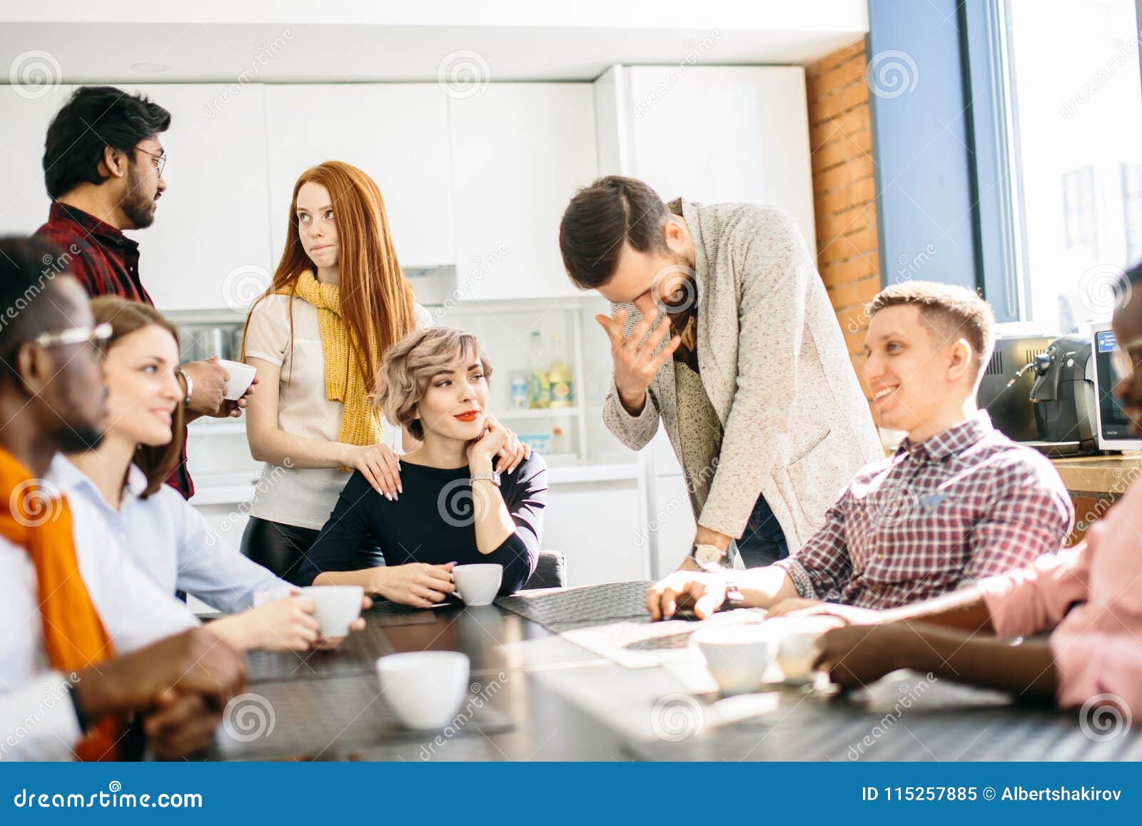 Embarrassed Young Man is Smiling during the Conversation Stock Image ...