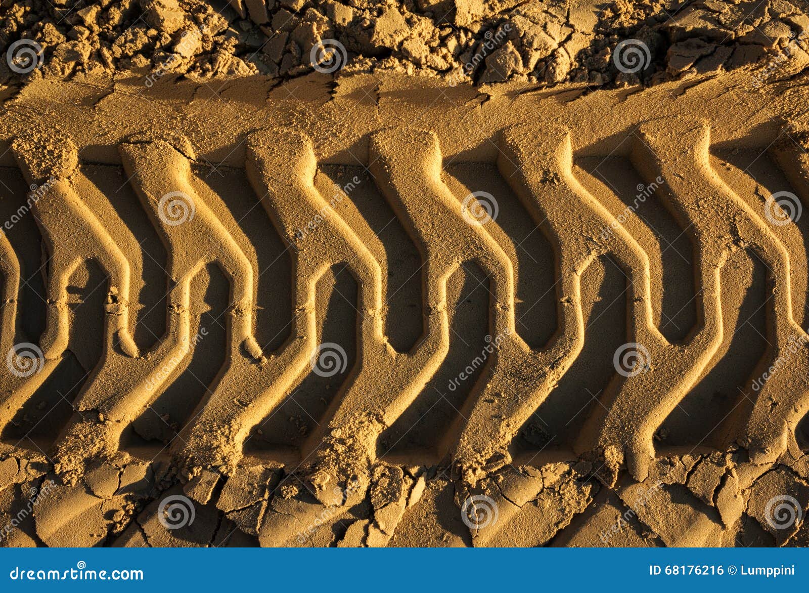 Embossed Trail Excavator Tracks on the Sand. Closeup Texture of Stock ...