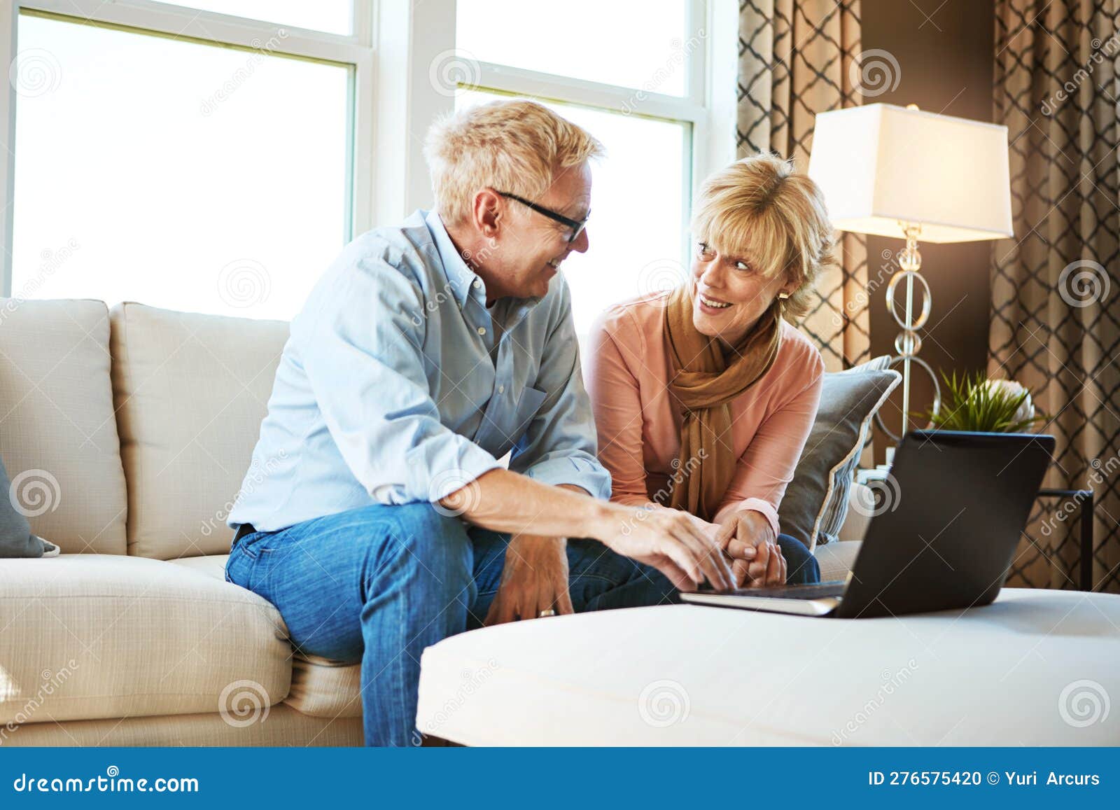 Embracing Technology with Ease. a Mature Couple Using a Laptop Together ...