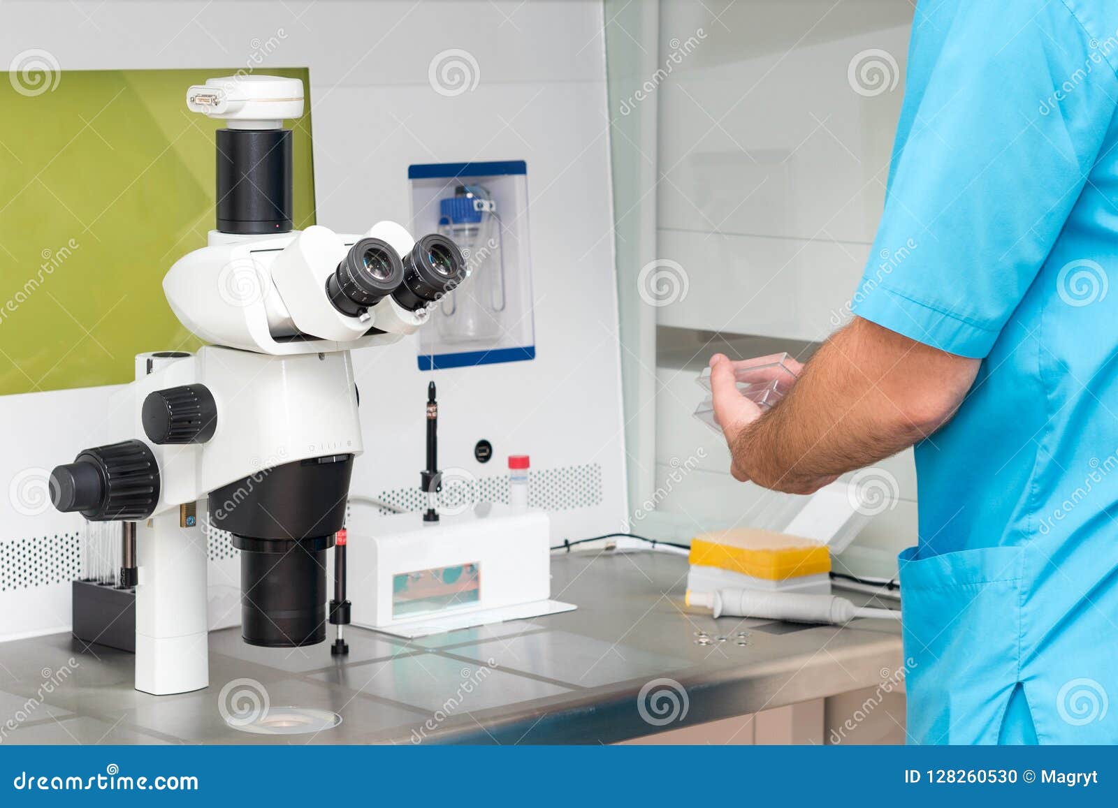 Embryologist or Lab Technician Working with Human Egg Under the ...