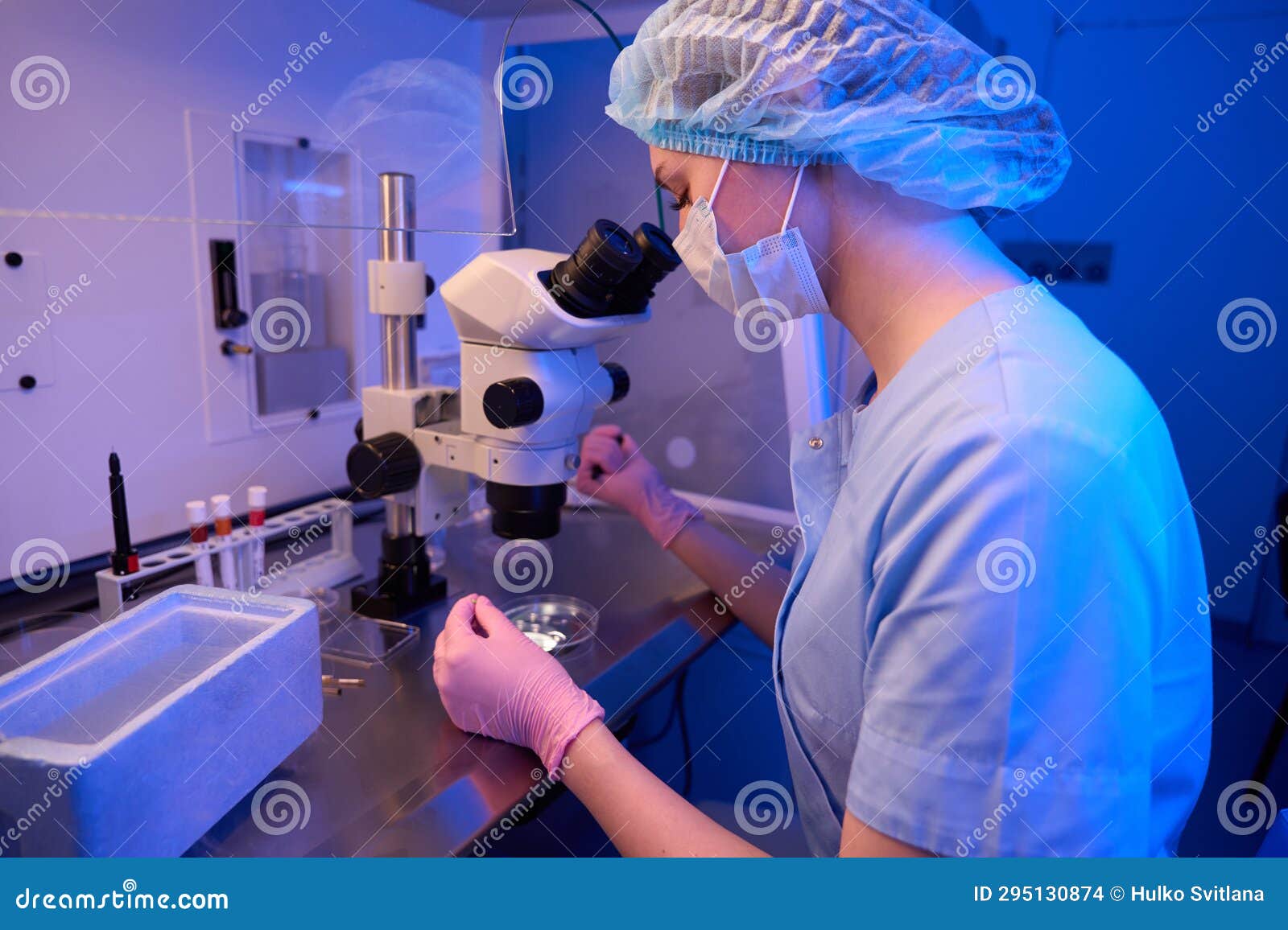 Embryologist is Performing in Vitro Fertilization Procedure Under ...