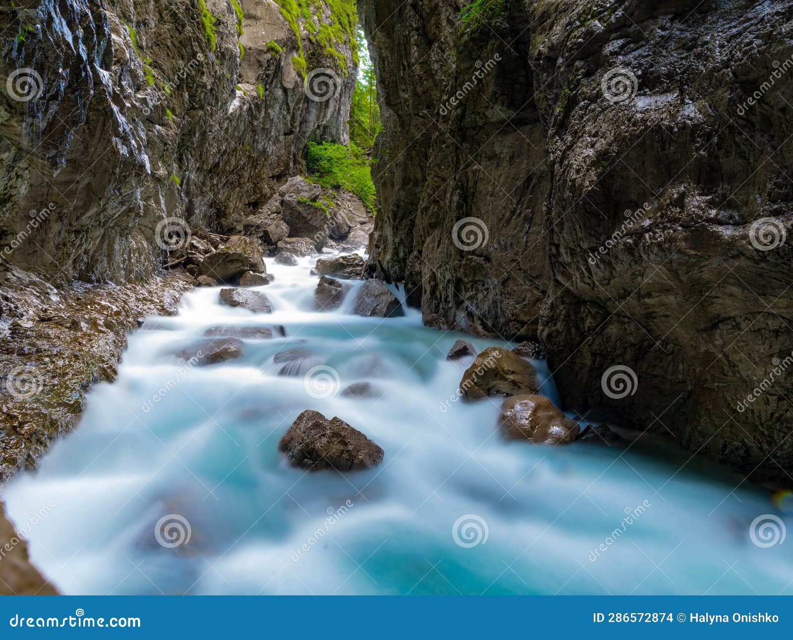 Emerald Blue River Flows among the Rocks in the Mountains Stock Photo ...