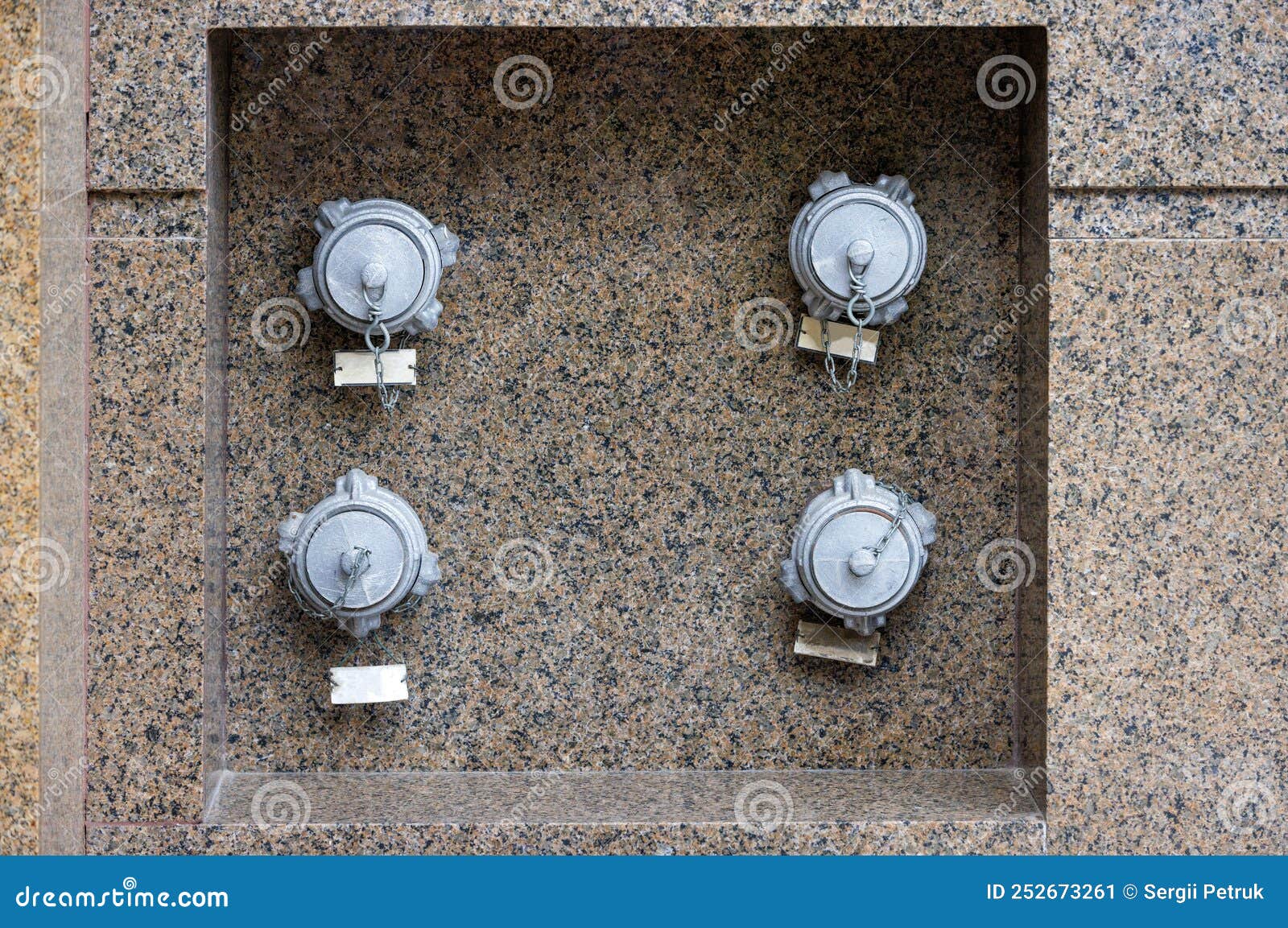 Fire Hydrants Embedded in the Granite Wall of the Building Stock Image ...