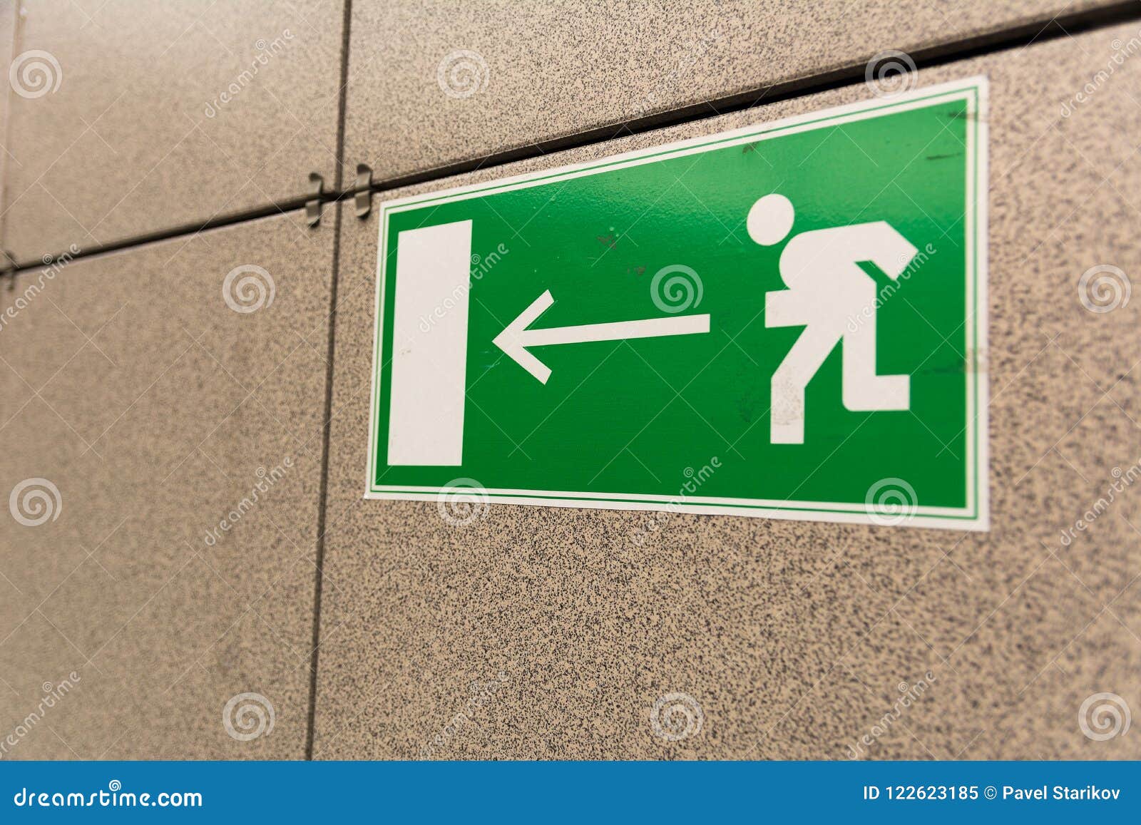 Emergency Evacuation Sign on Wall Stock Image - Image of display ...