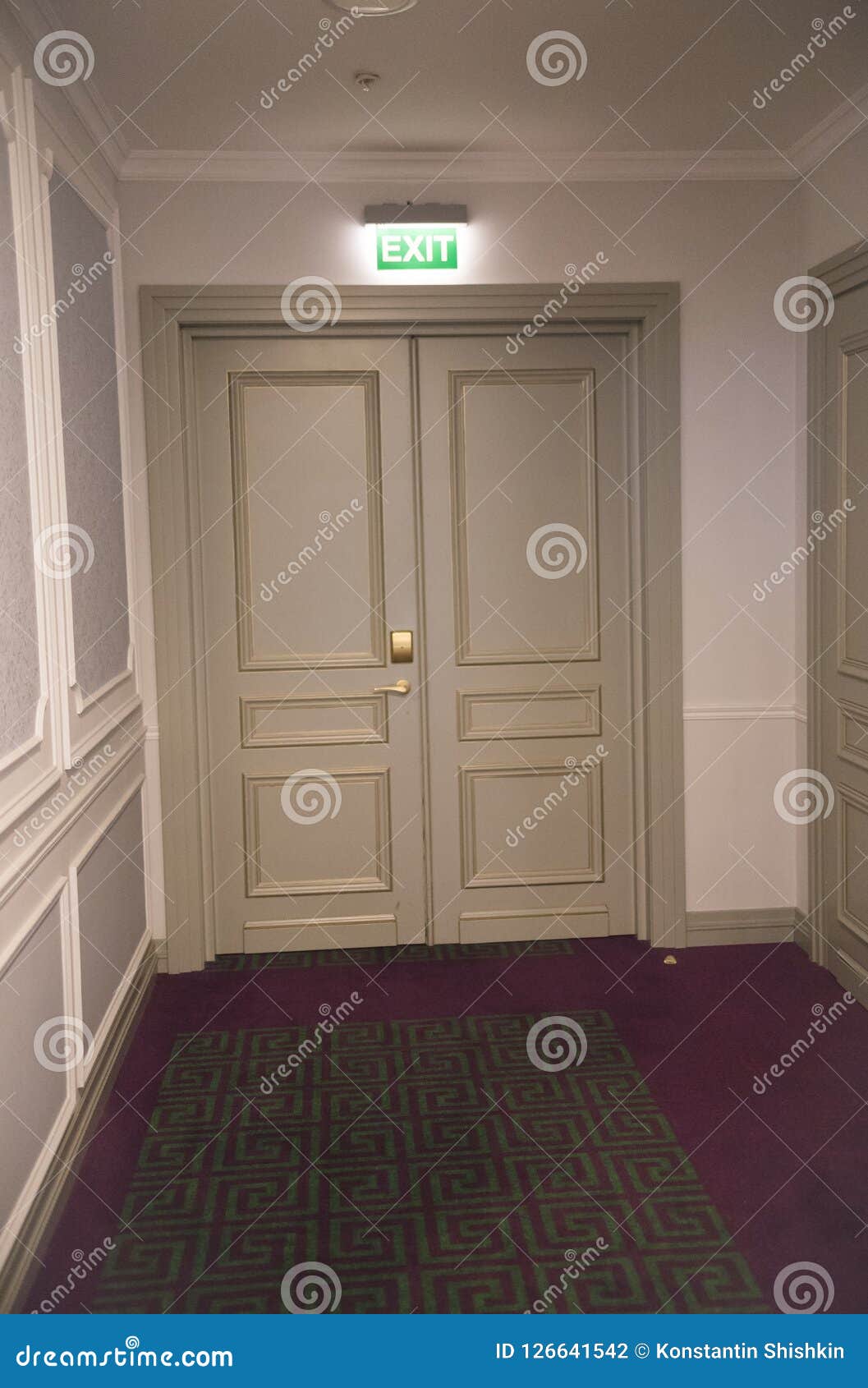 Emergency Exit Door in a Restaurant with a Neon Sign Stock Photo ...