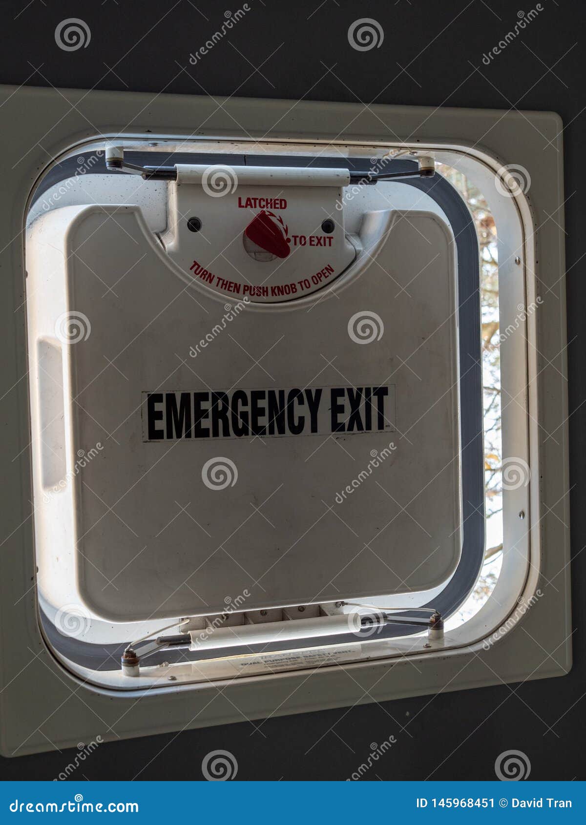 Emergency Exit Hatch Partially Open in a Bus with Latch and Daytime ...