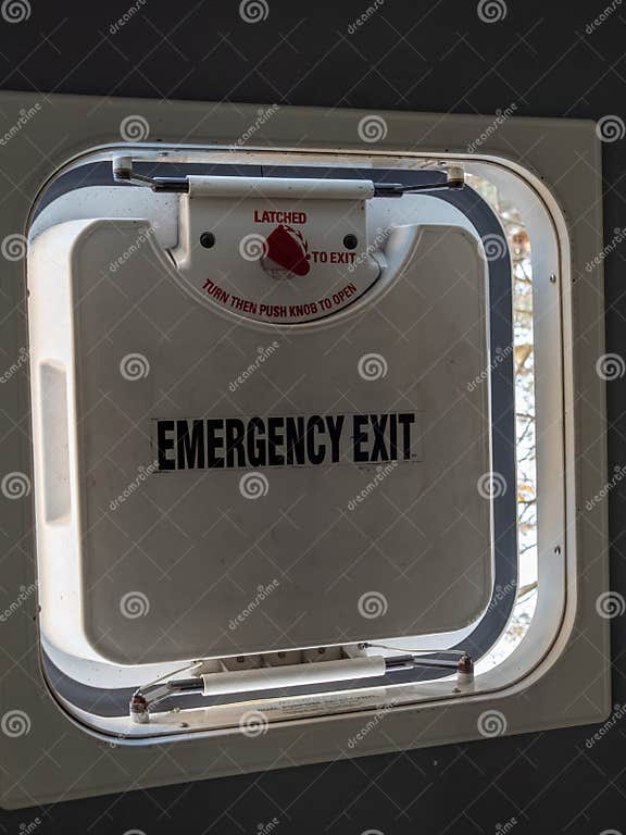 Emergency Exit Hatch Partially Open in a Bus with Latch and Daytime ...