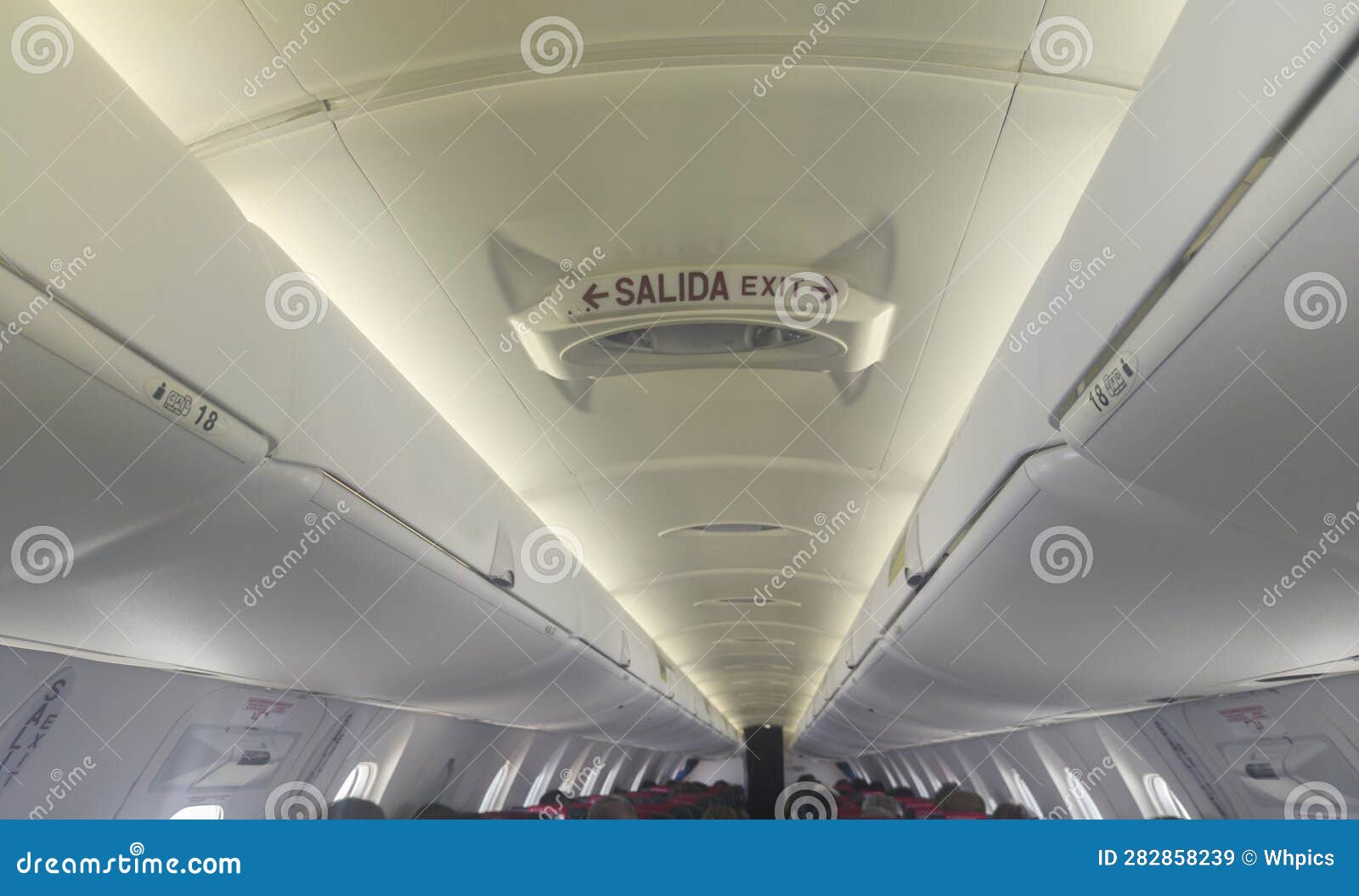 Emergency Exit Sign in Aircraft Cabin Ceiling Stock Image - Image of ...