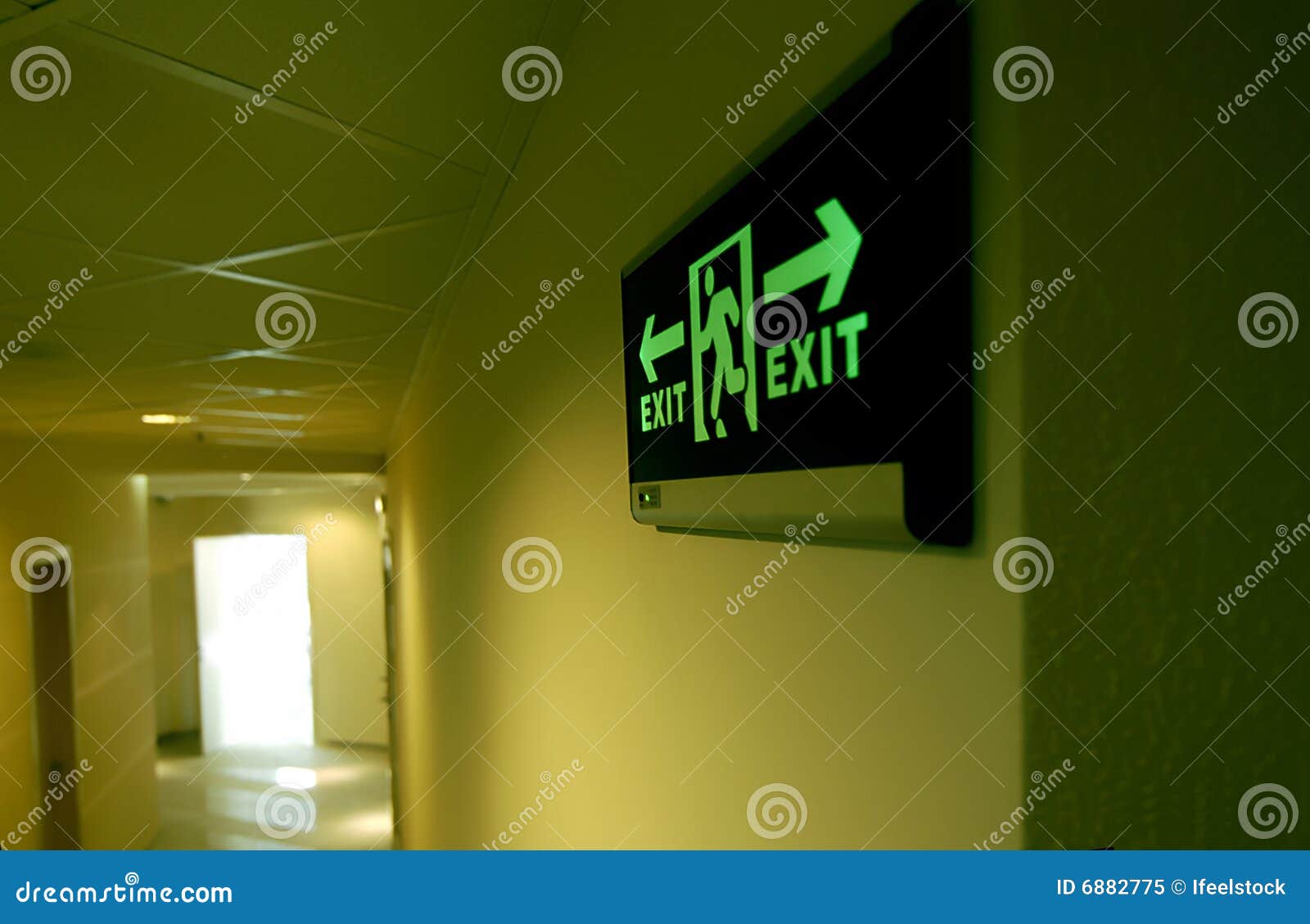 Emergency Exit Sign in a Building Glowing Green Stock Image - Image of ...