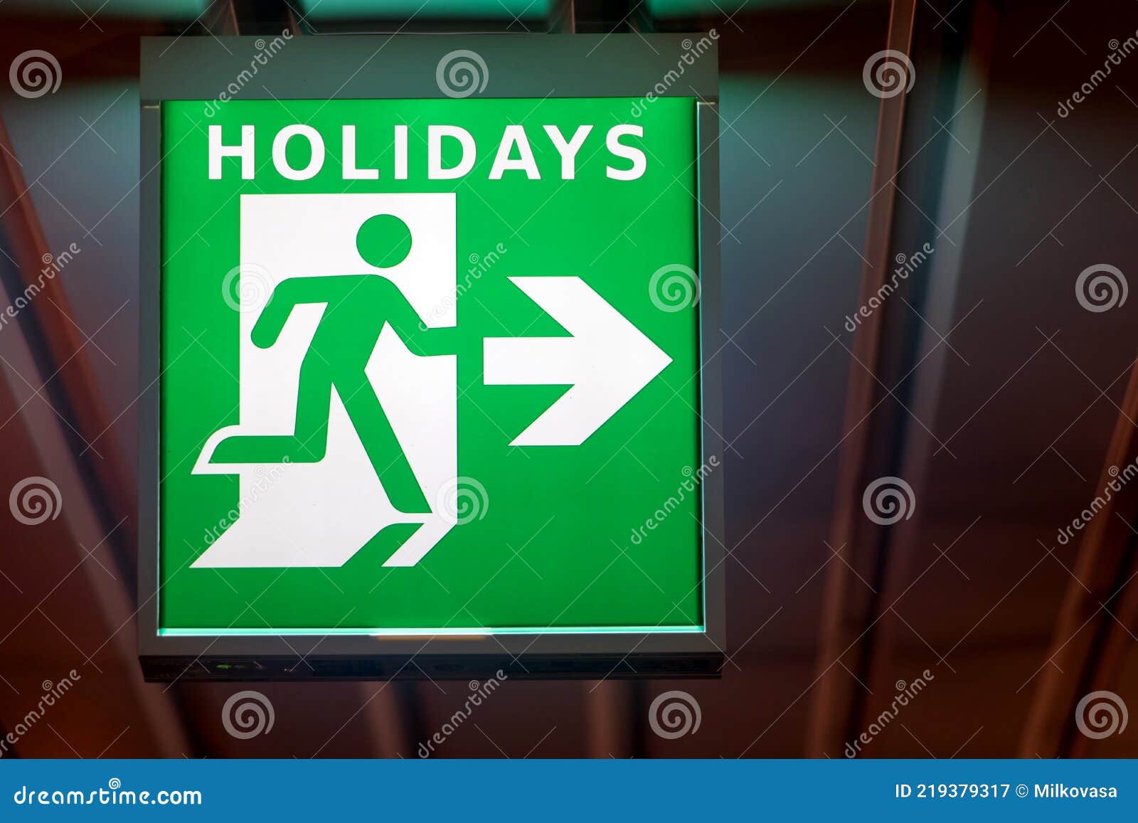 The Emergency Exit Sign Indicates the Direction of Way To Holidays ...
