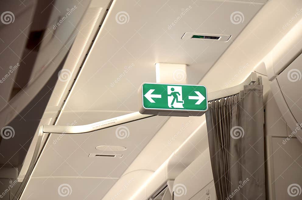 Emergency Exit Sign on the Plane Stock Photo - Image of aircraft, exit ...