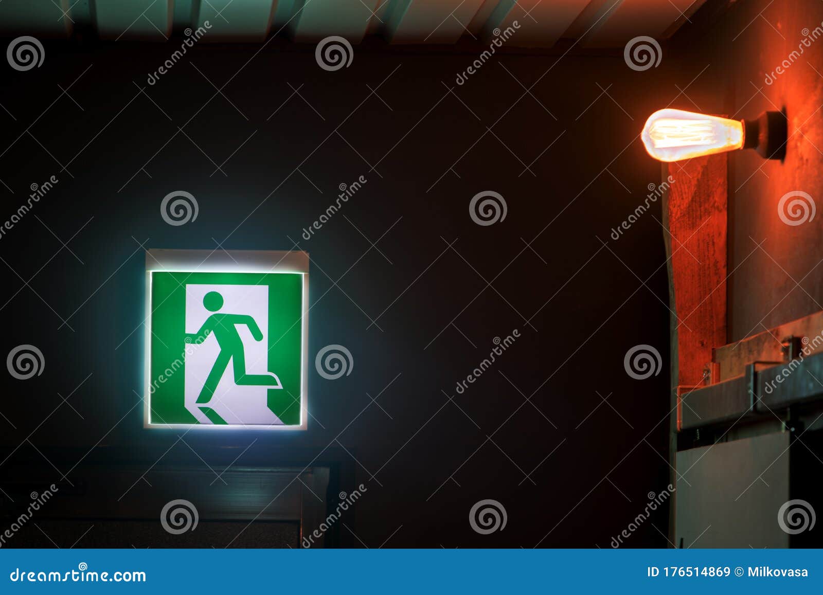 The Emergency Exit Sign Shows the Direction of Escape in Case of Danger ...