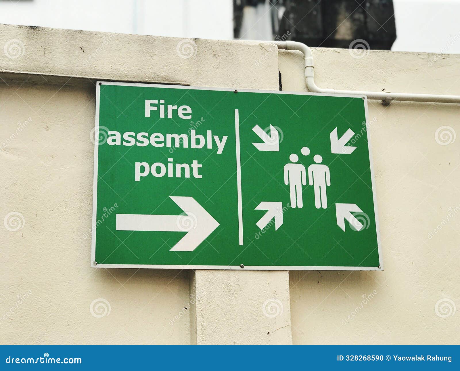 Emergency Exit Sign on the Wall of a Building. Keep Your Distance Stock ...