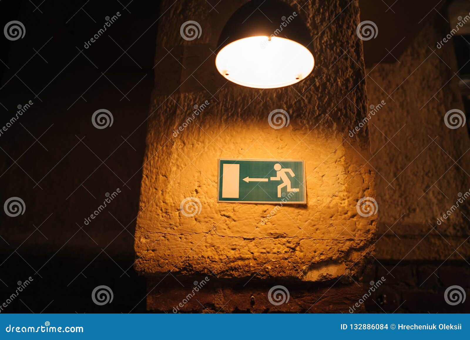 Emergency Fire Escape Sign on the Empty Wall. Stock Photo - Image of ...