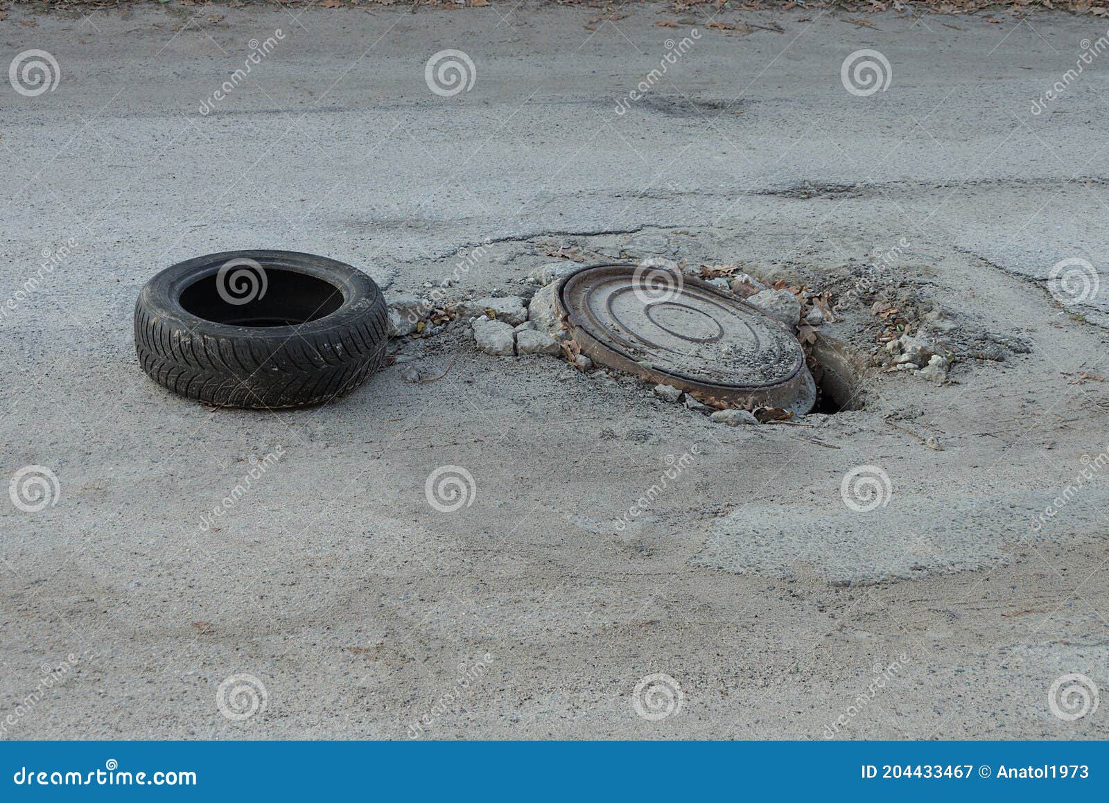Emergency Section of a Gray Asphalt Road with a Pit and a Sewer Hatch ...