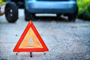 Emergency Stop Sign in Backround with Broken Down Car Stock Photo ...