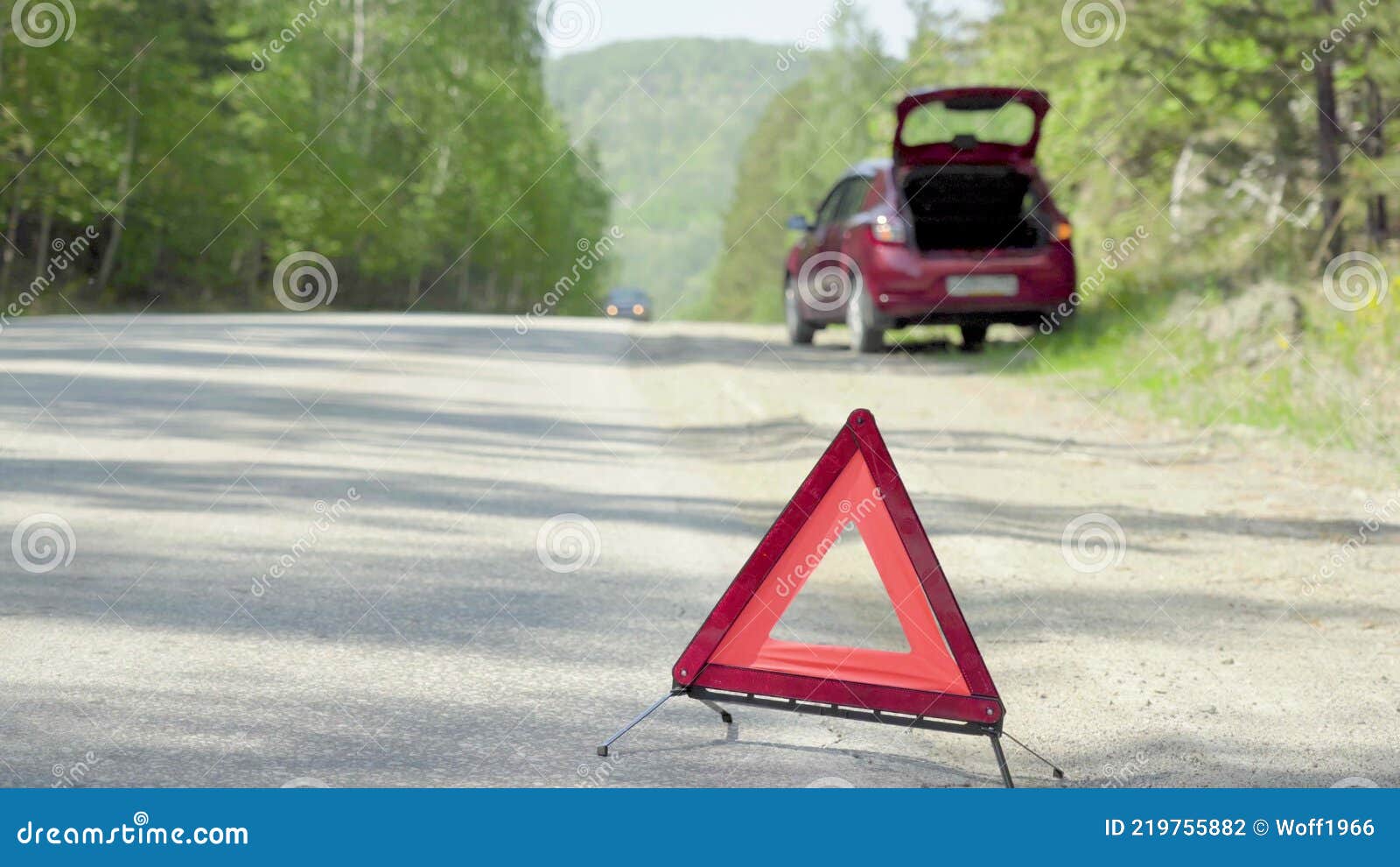 Emergency Stop Sign on a Forest Highway in Front of a Broken Car Stock ...